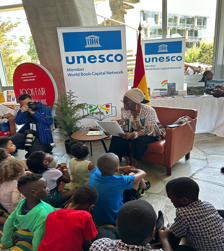H.E. Ms. Anna Bossman reads with children | GBDC